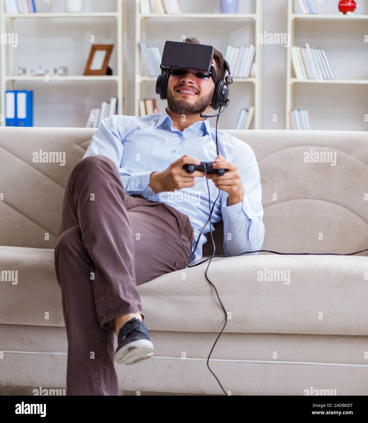 Student gamer playing games at home Stock Photo - Alamy
