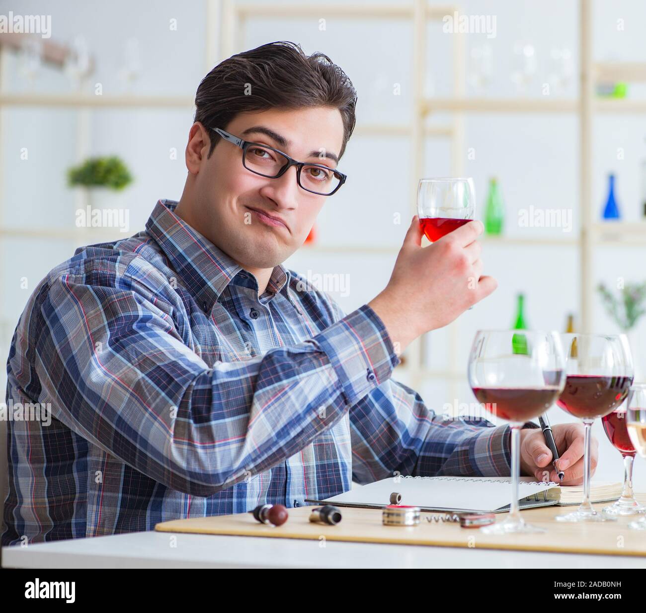 Professional sommelier tasting red wine Stock Photo - Alamy