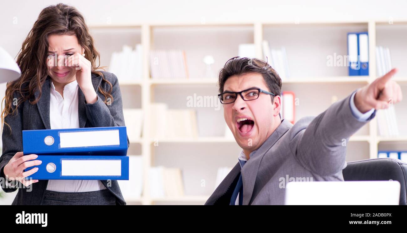 Angry boss unhappy with female employee performance Stock Photo - Alamy