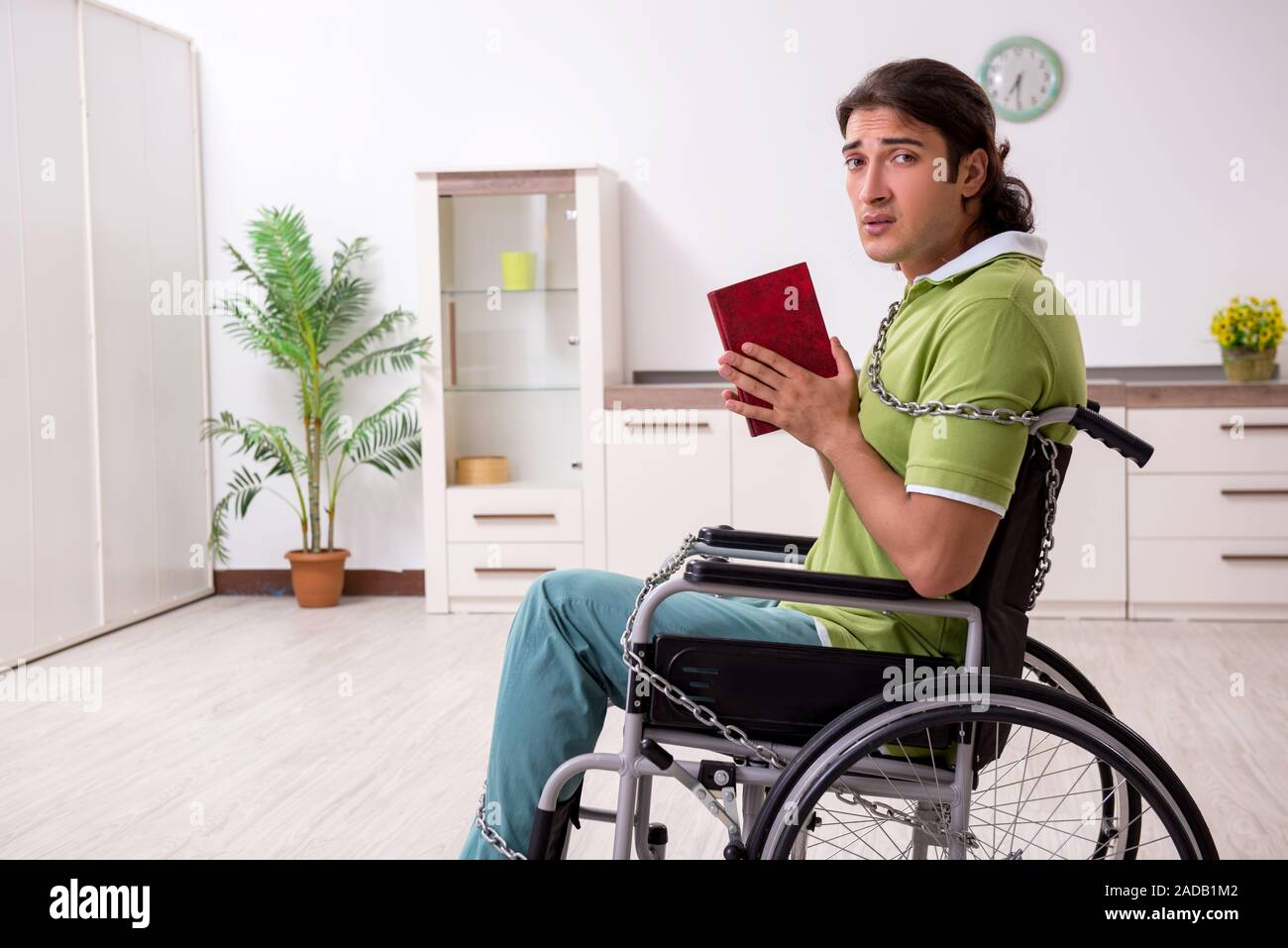 Restrained wheelchair hi-res stock photography and images - Alamy