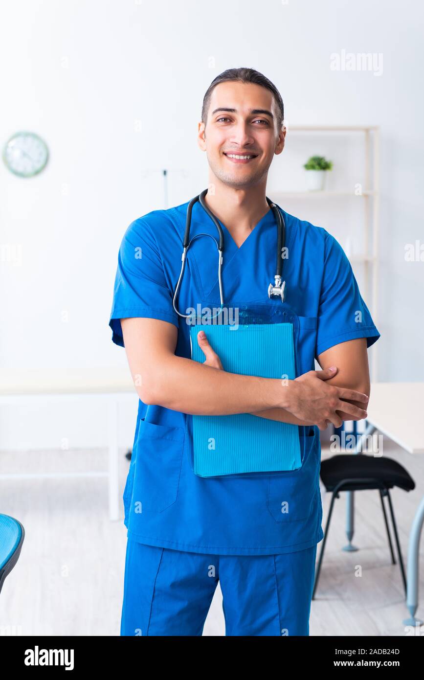 Young male doctor working in the clinic Stock Photo - Alamy