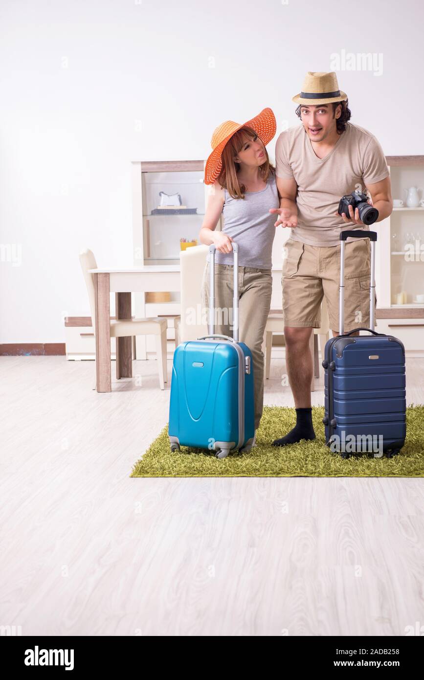 Young couple preparing for trip Stock Photo - Alamy