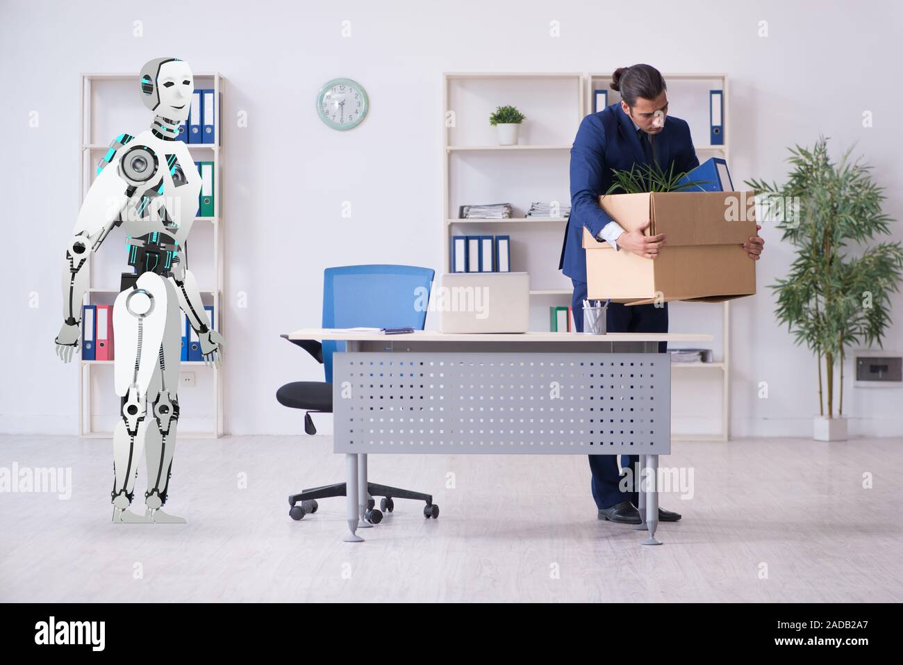 Concept of robots replacing humans in offices Stock Photo - Alamy