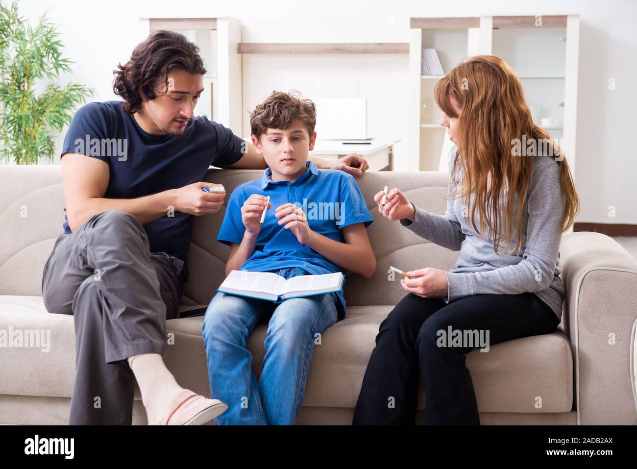 Concept of underage smoking with young boy and family Stock Photo - Alamy