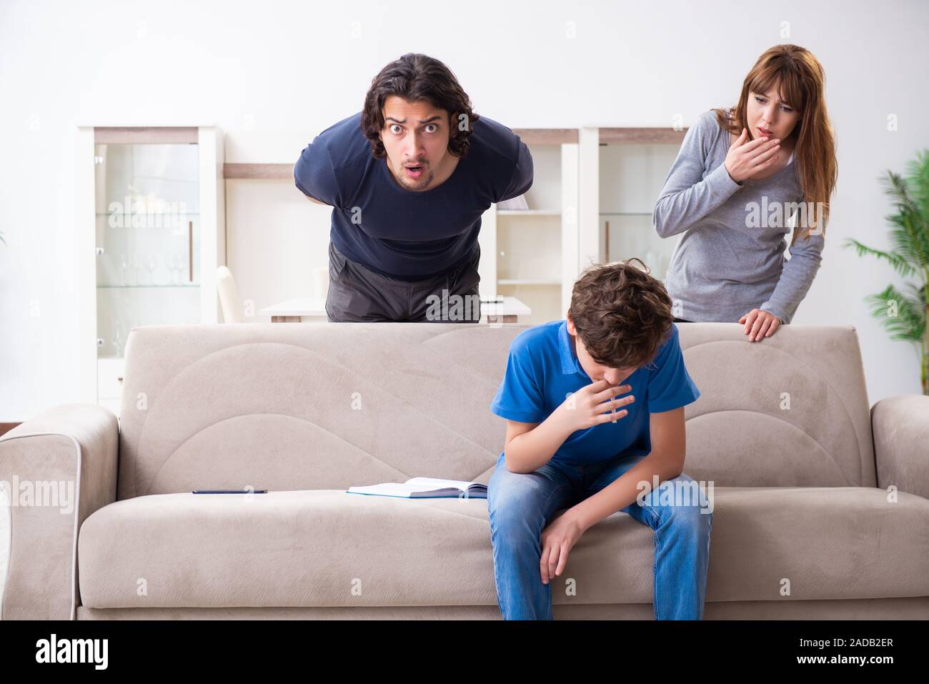 Concept of underage smoking with young boy and family Stock Photo - Alamy