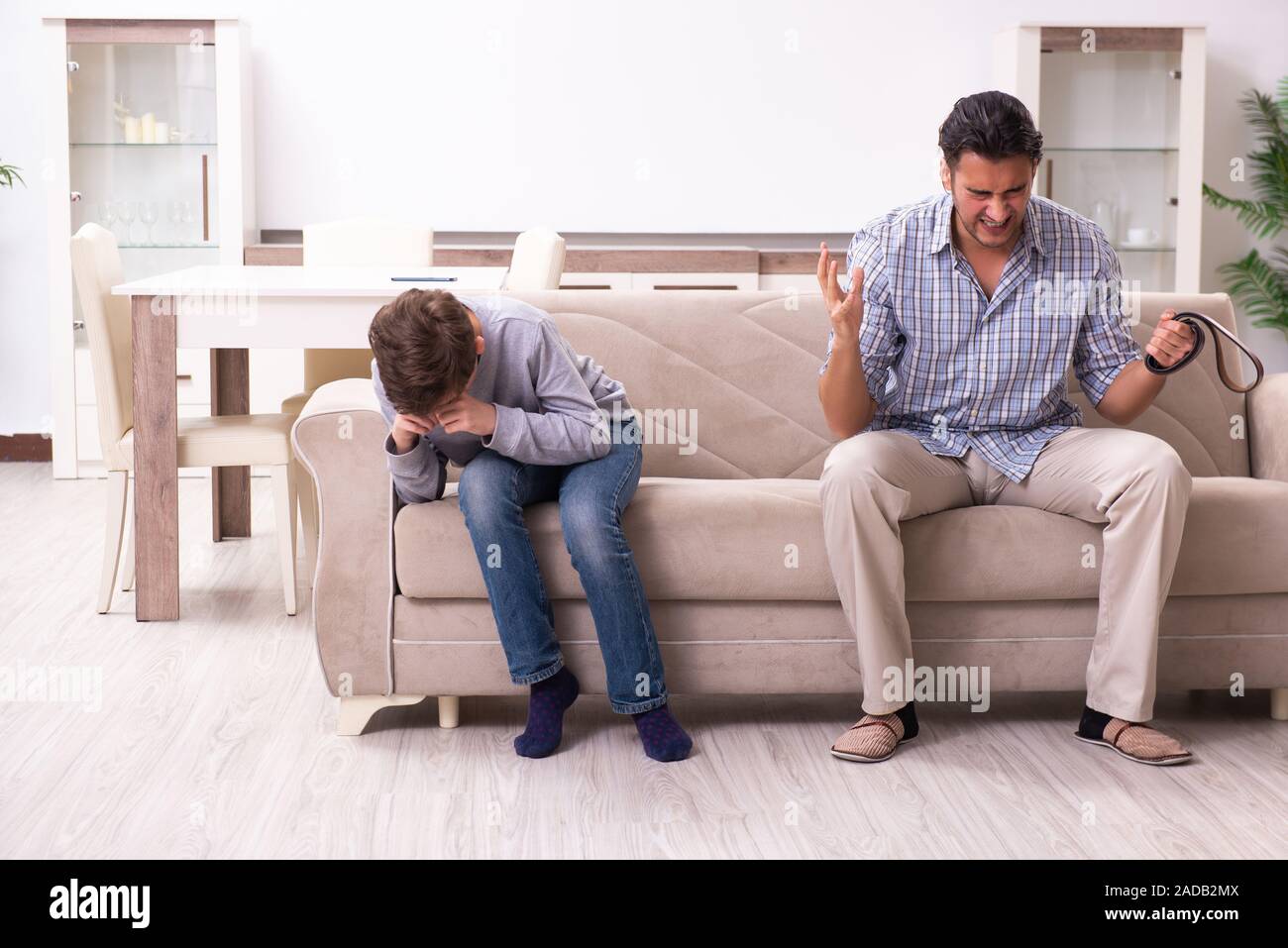 Father punishing son hi-res stock photography and images - Alamy
