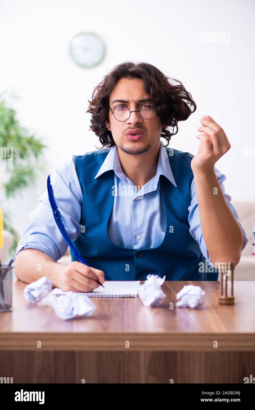 Young writer working on his new work Stock Photo - Alamy