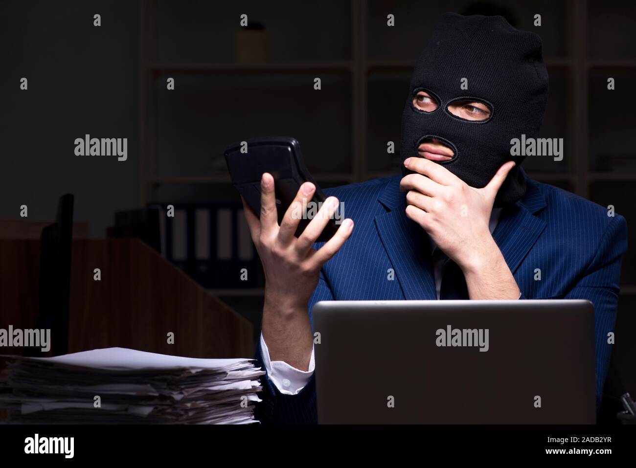 Male employee stealing information in the office night time Stock Photo ...