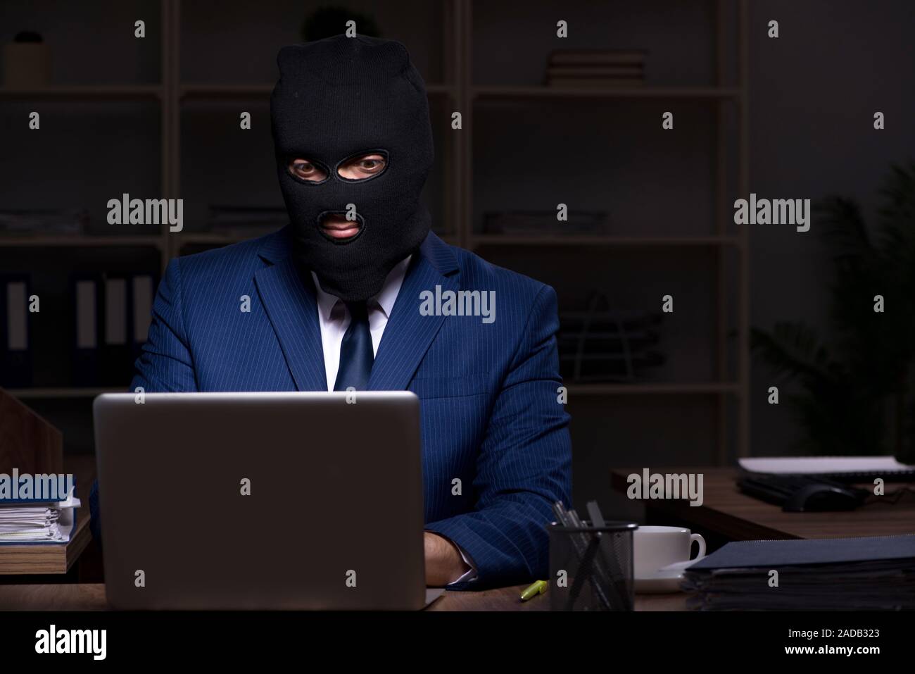 Male employee stealing information in the office night time Stock Photo ...