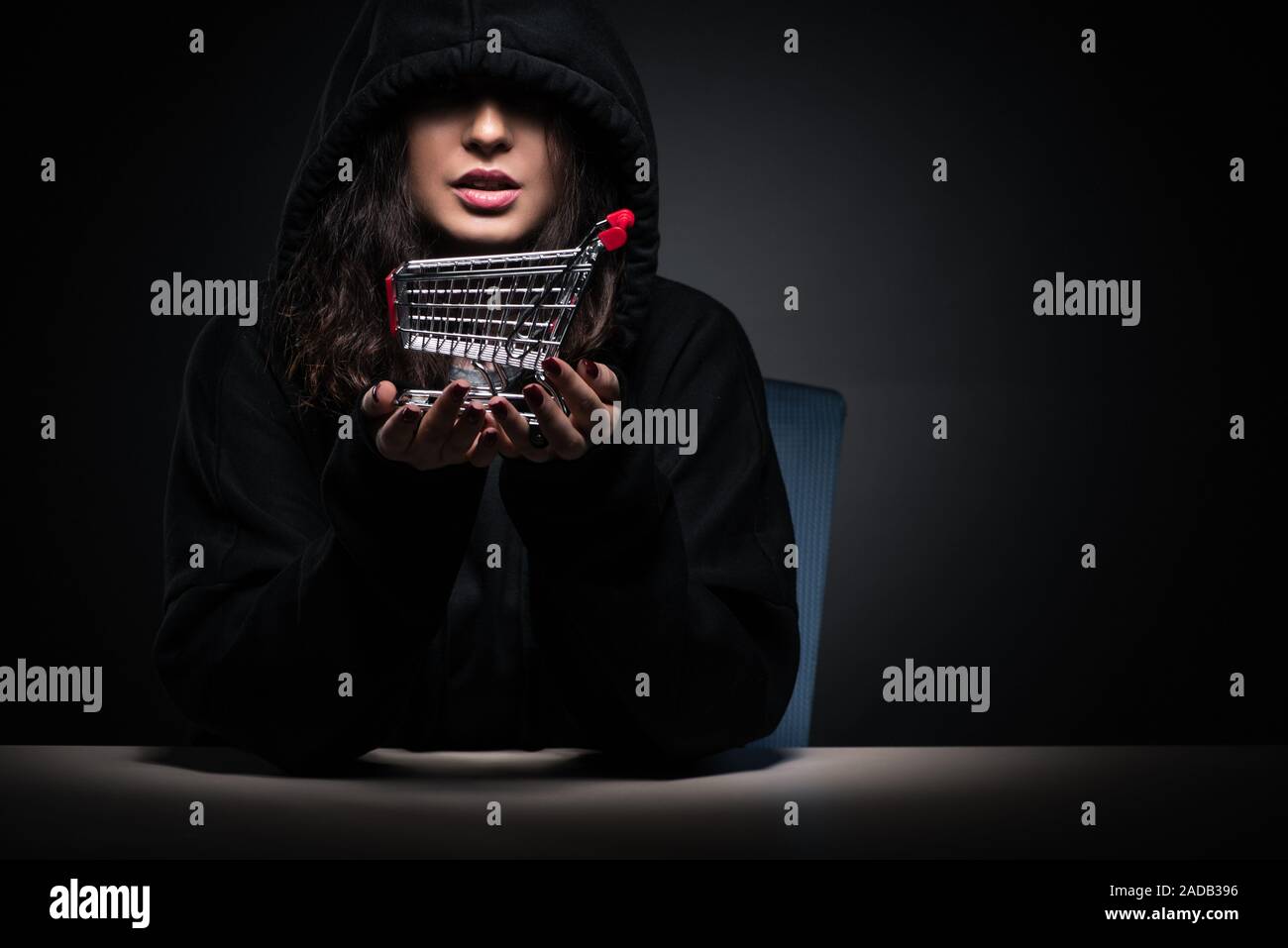 Female hacker hacking security firewall late in office Stock Photo - Alamy