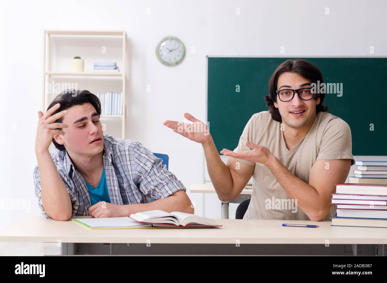 Two male students in the classroom Stock Photo - Alamy