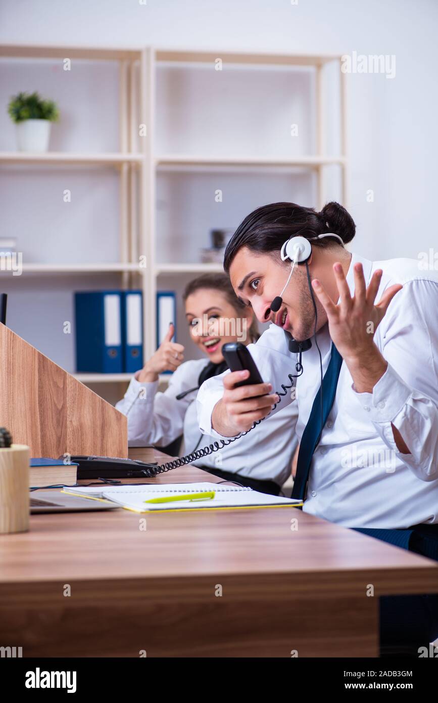 Call center operators working in the office Stock Photo - Alamy