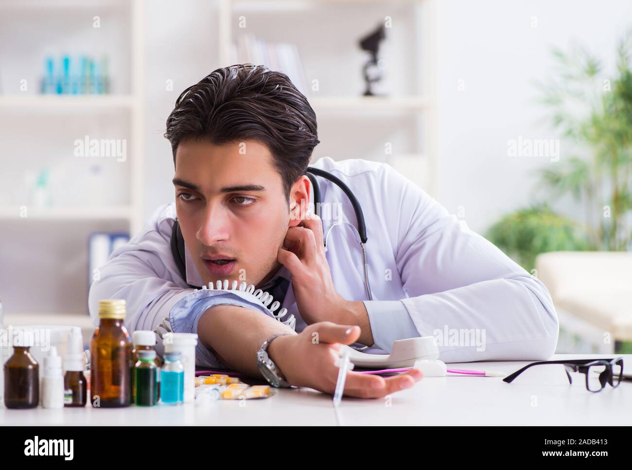 The doctor drug addict in the hospital Stock Photo - Alamy