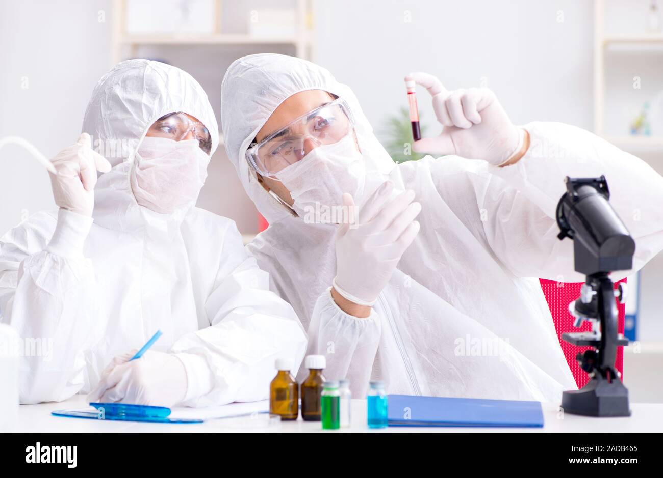 Two chemists working in the lab Stock Photo - Alamy