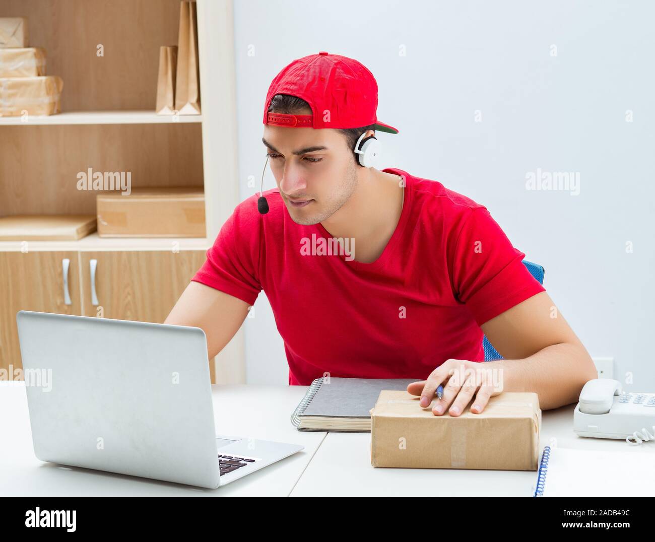 Call center worker at parcel distribution center in post office Stock ...