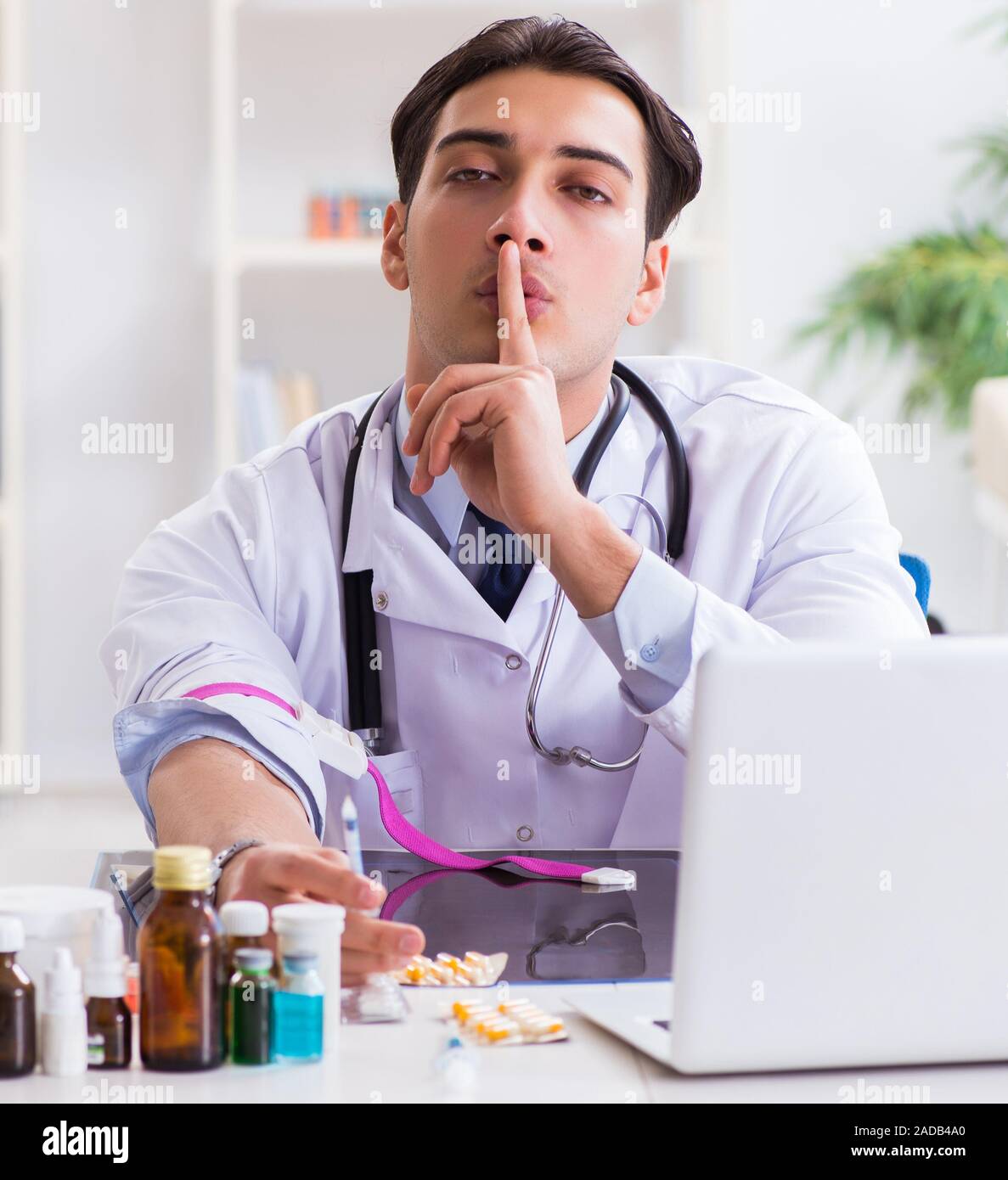 The doctor drug addict in the hospital Stock Photo - Alamy