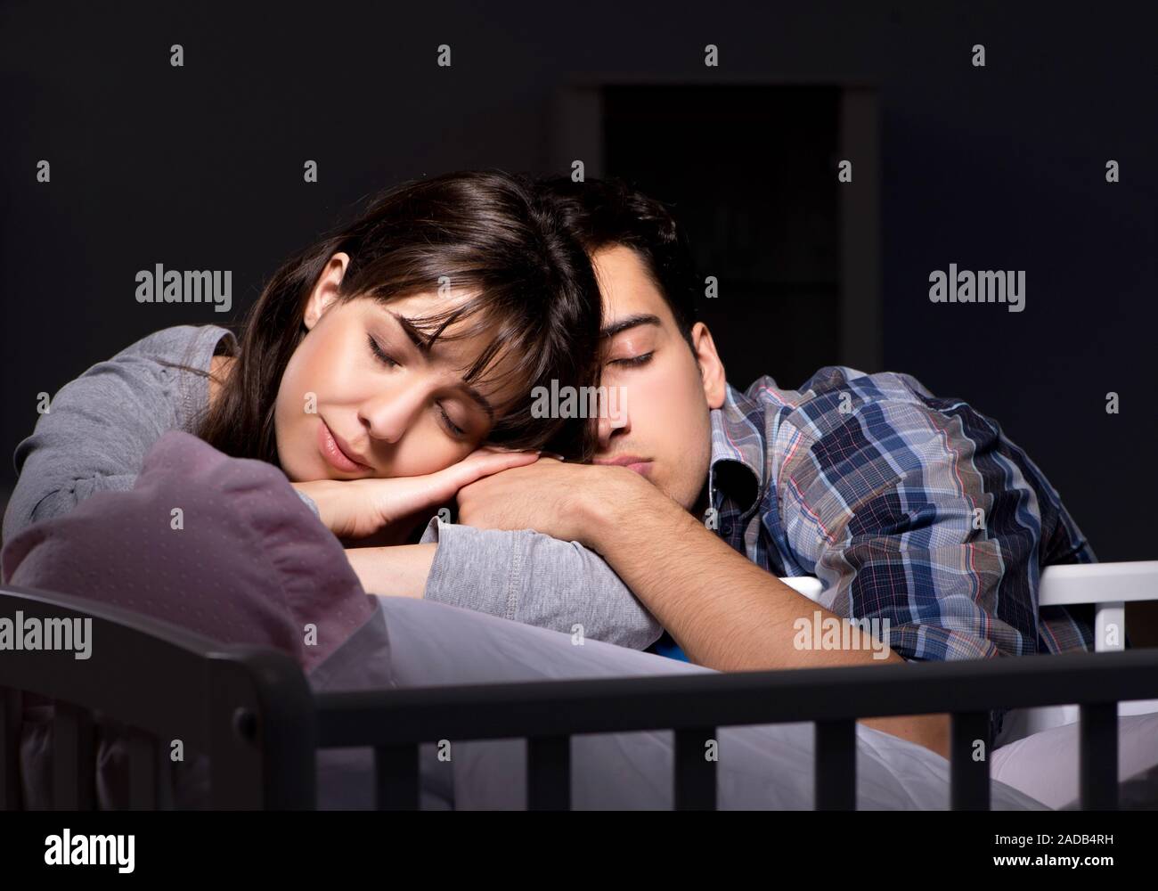 Young parents sleepless with newborn baby at night Stock Photo - Alamy