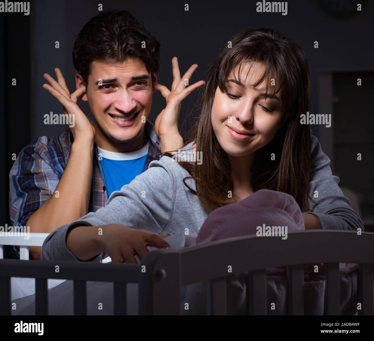 Young parents sleepless with newborn baby at night Stock Photo - Alamy