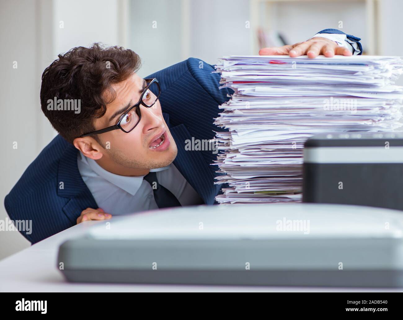 The Businessman making copies in copying machine Stock Photo - Alamy