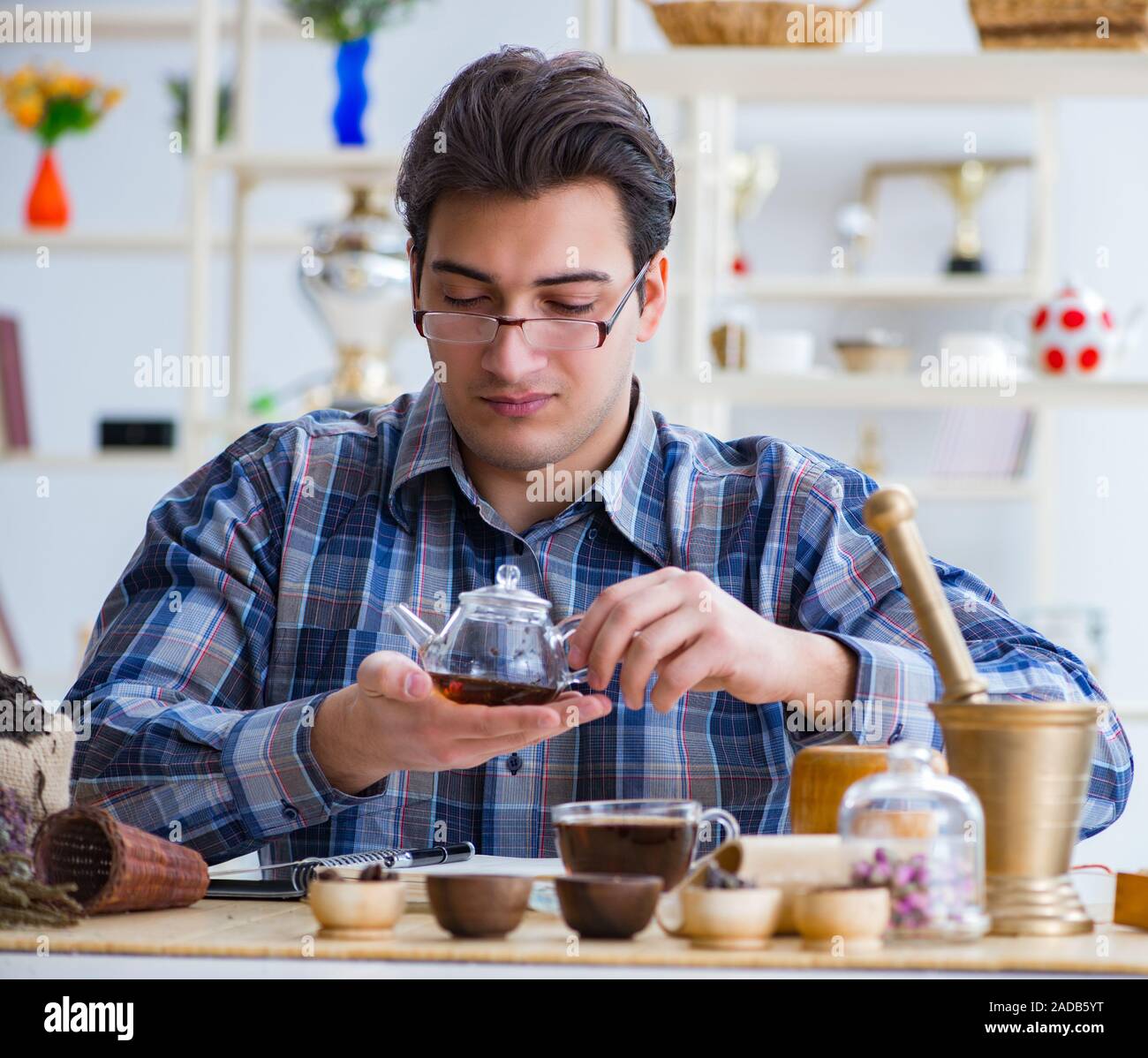 Tea expert brewing cup of drink hi-res stock photography and images - Alamy