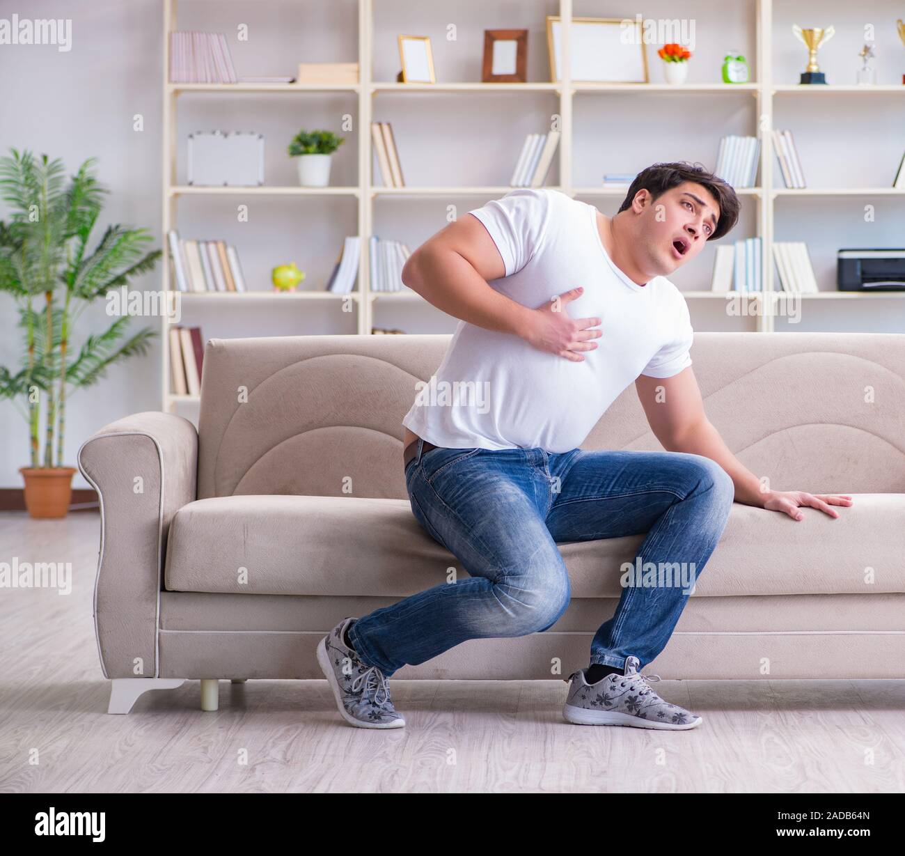 Man suffering from sick stomach and vomiting Stock Photo - Alamy