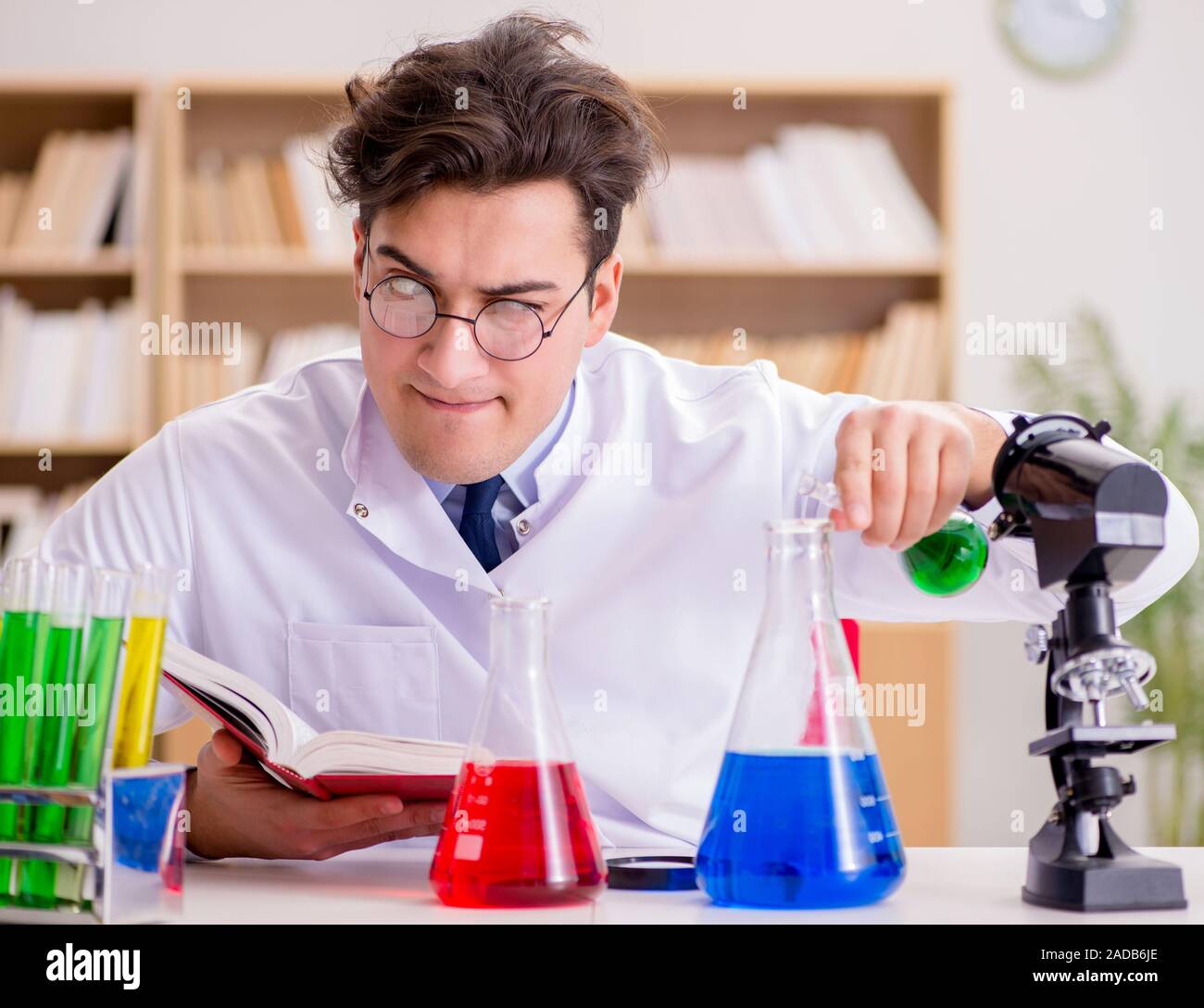 Mad crazy scientist doctor doing experiments in a laboratory Stock ...