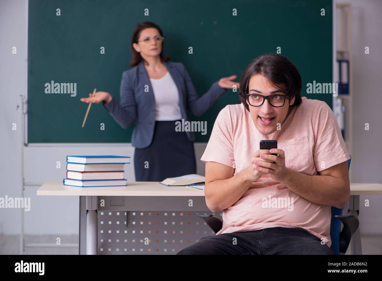 High school student texting in class hi-res stock photography and ...