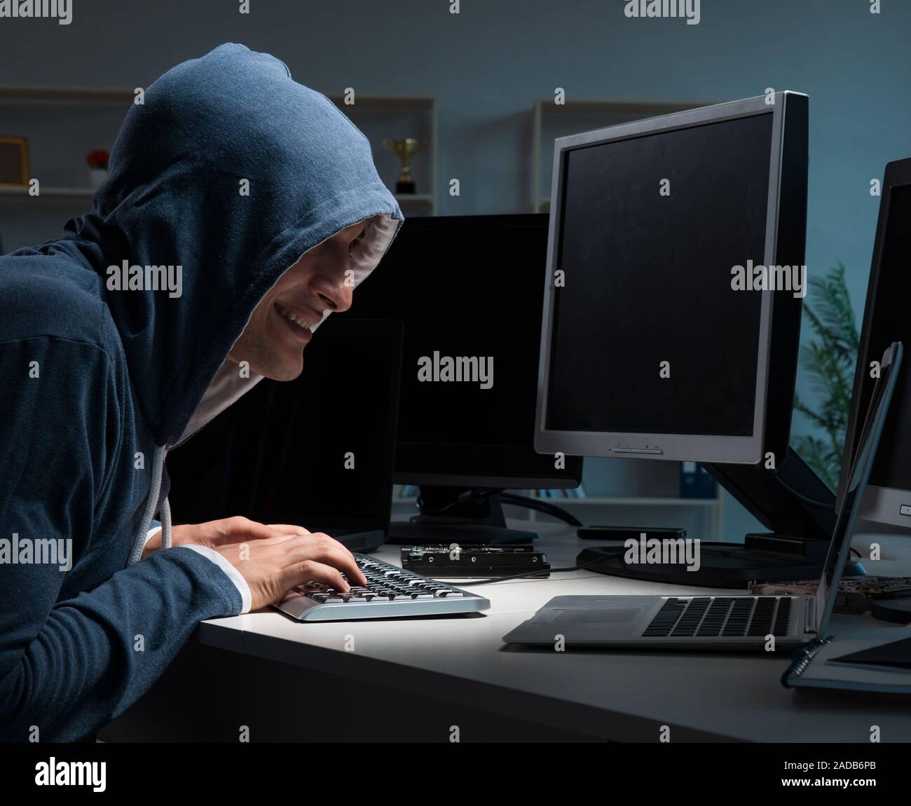 Hacker hacking computer at night Stock Photo - Alamy