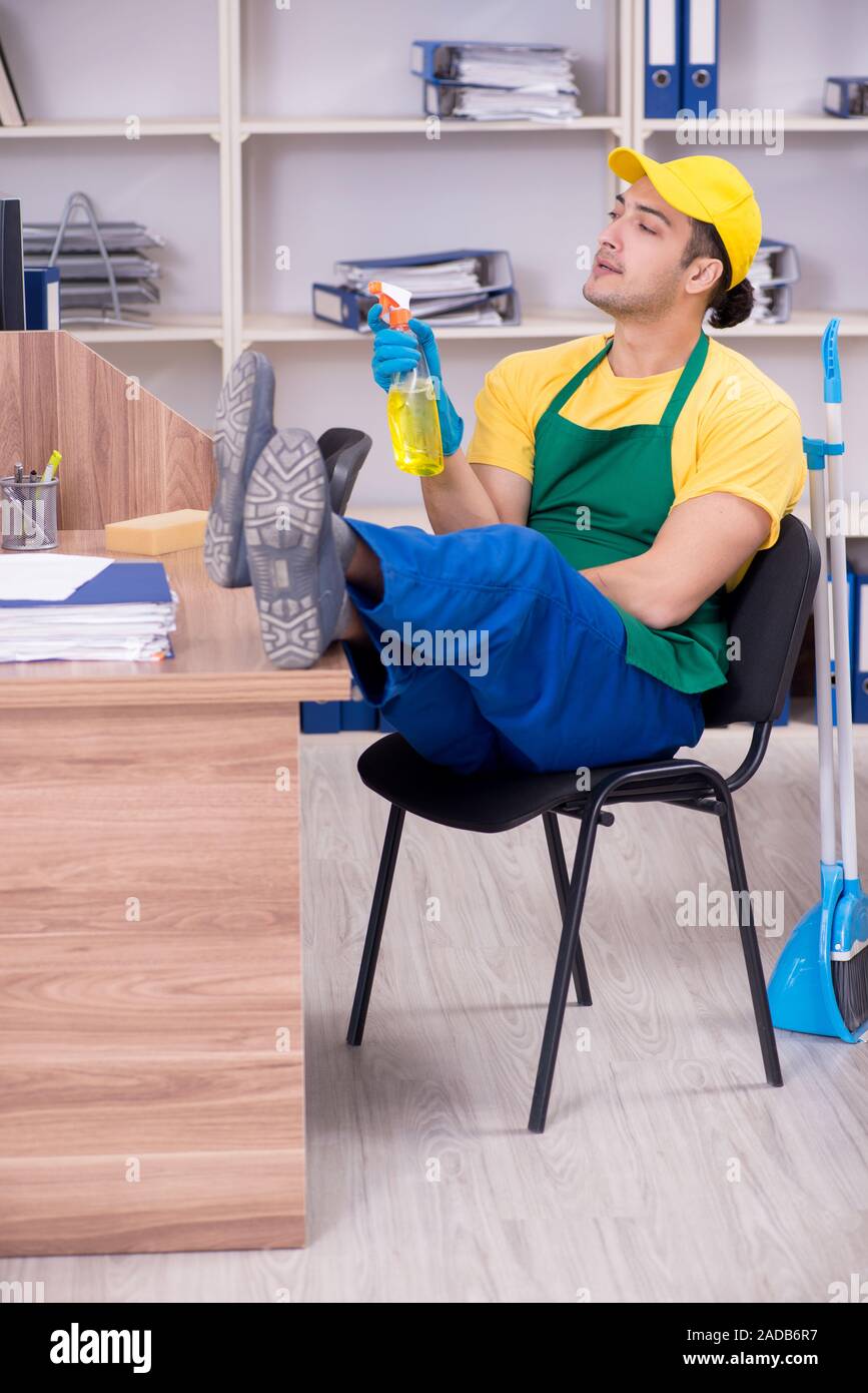 Tired male janitor cleaning hi-res stock photography and images - Alamy