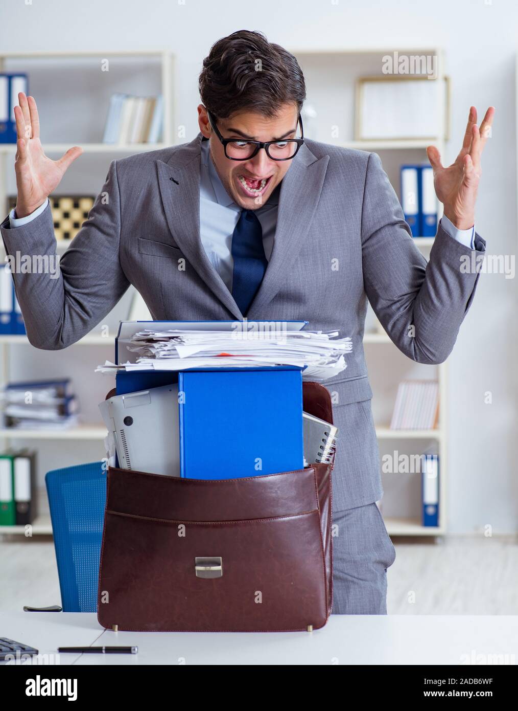 Employee with too much work taking it home Stock Photo - Alamy