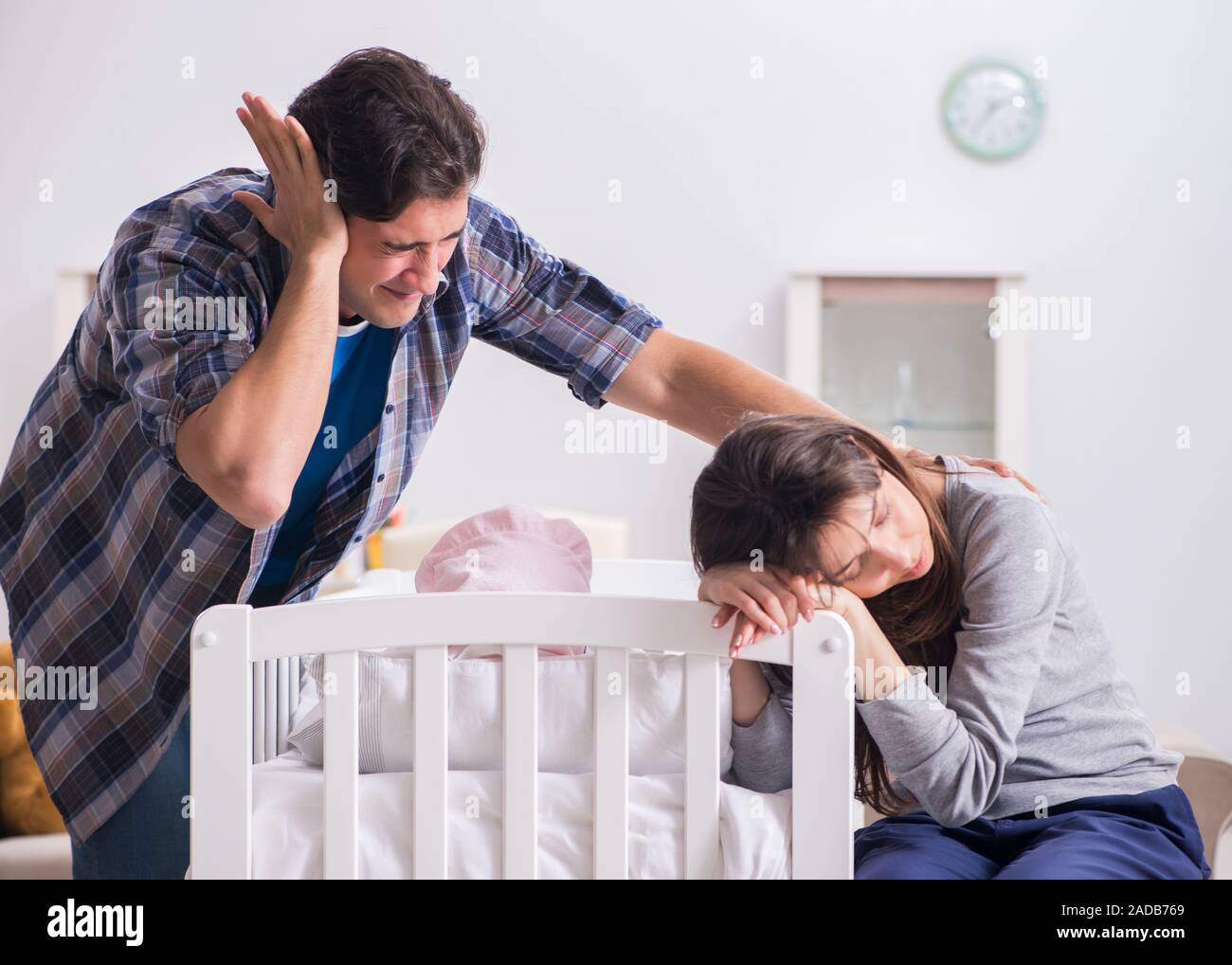 Crying mother baby cot hi-res stock photography and images - Alamy