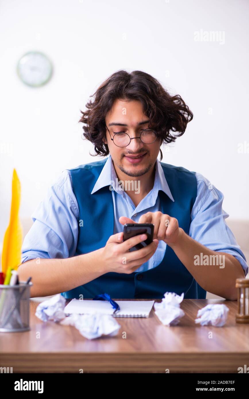 Young writer working on his new work Stock Photo - Alamy