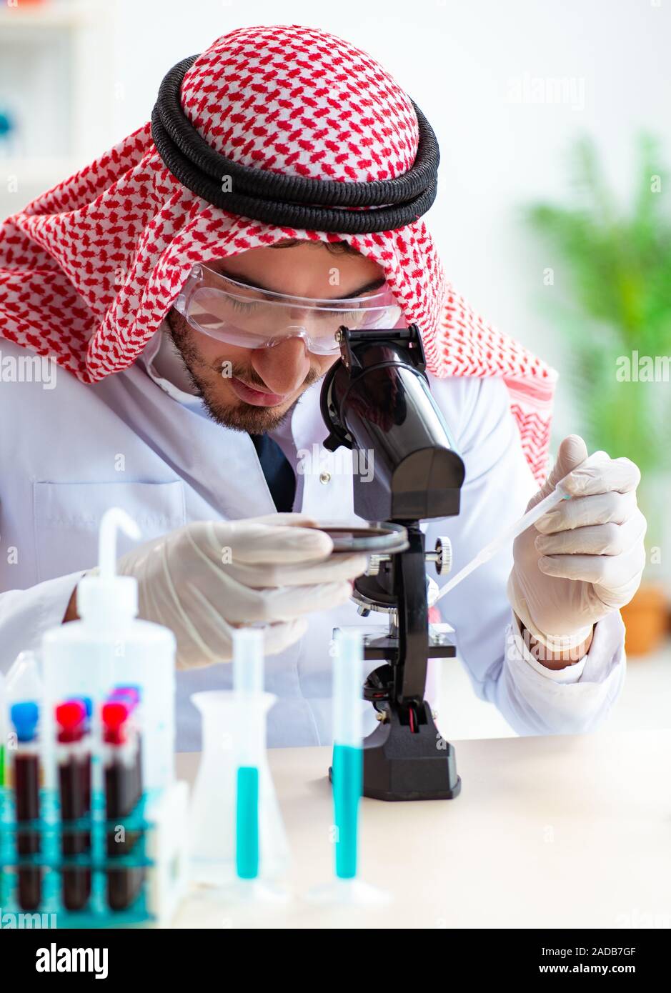 Arab chemist working in the lab office Stock Photo - Alamy