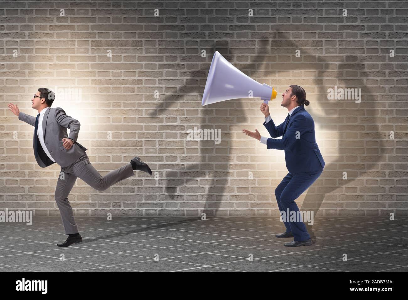 Businessman shouting through large loudspeaker Stock Photo - Alamy