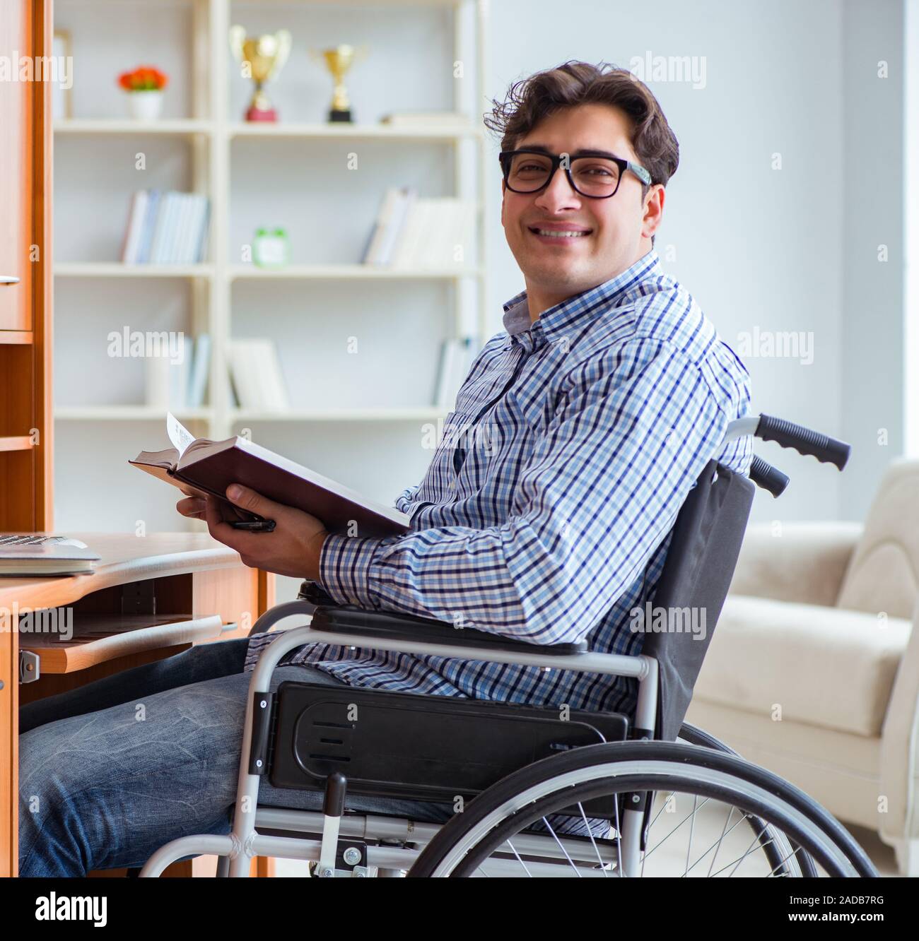 The disabled student studying at home on wheelchair Stock Photo - Alamy