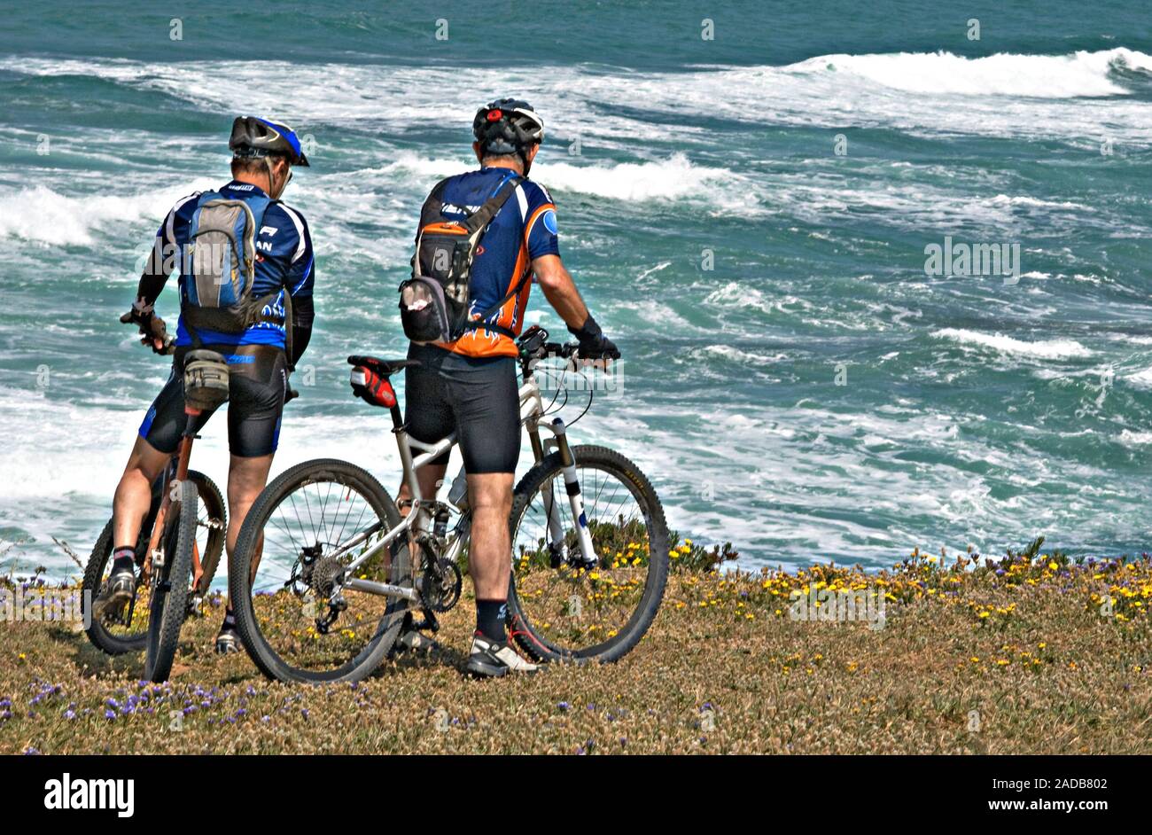 Two cyclists on sea beach Stock Photo - Alamy