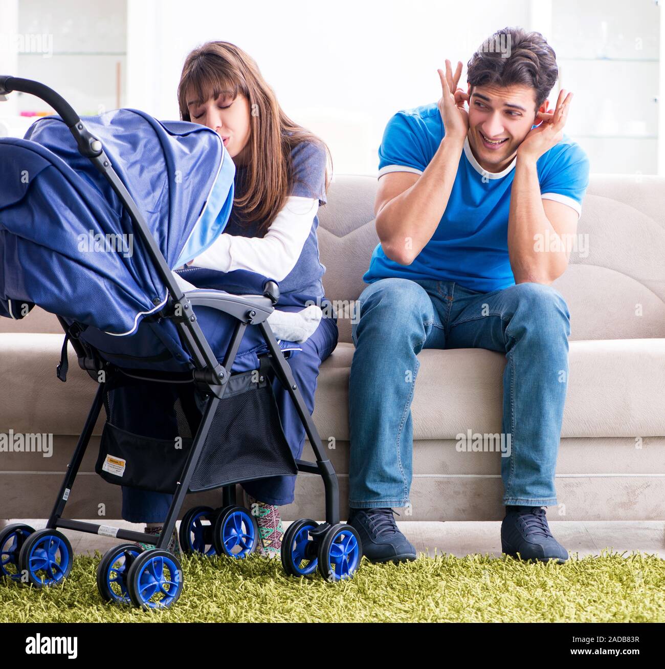 Young parents with their newborn baby in baby pram sitting on th Stock ...
