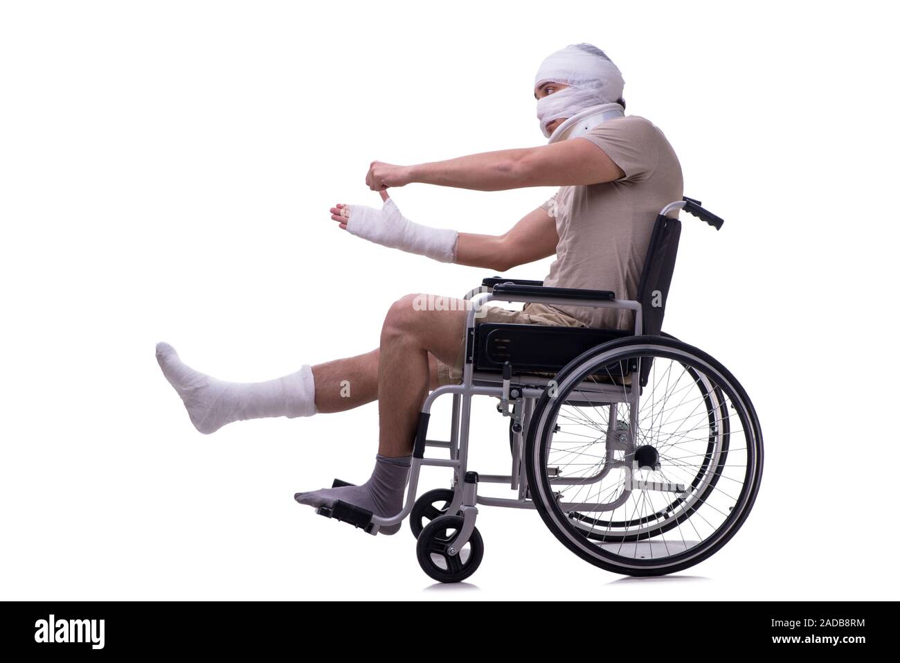 Injured man in wheel-chair isolated on white Stock Photo - Alamy