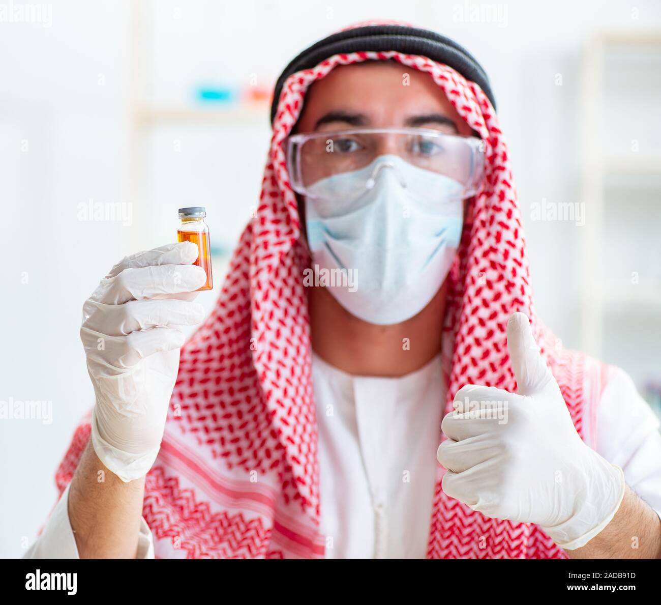 Arab chemist working in the lab office Stock Photo - Alamy