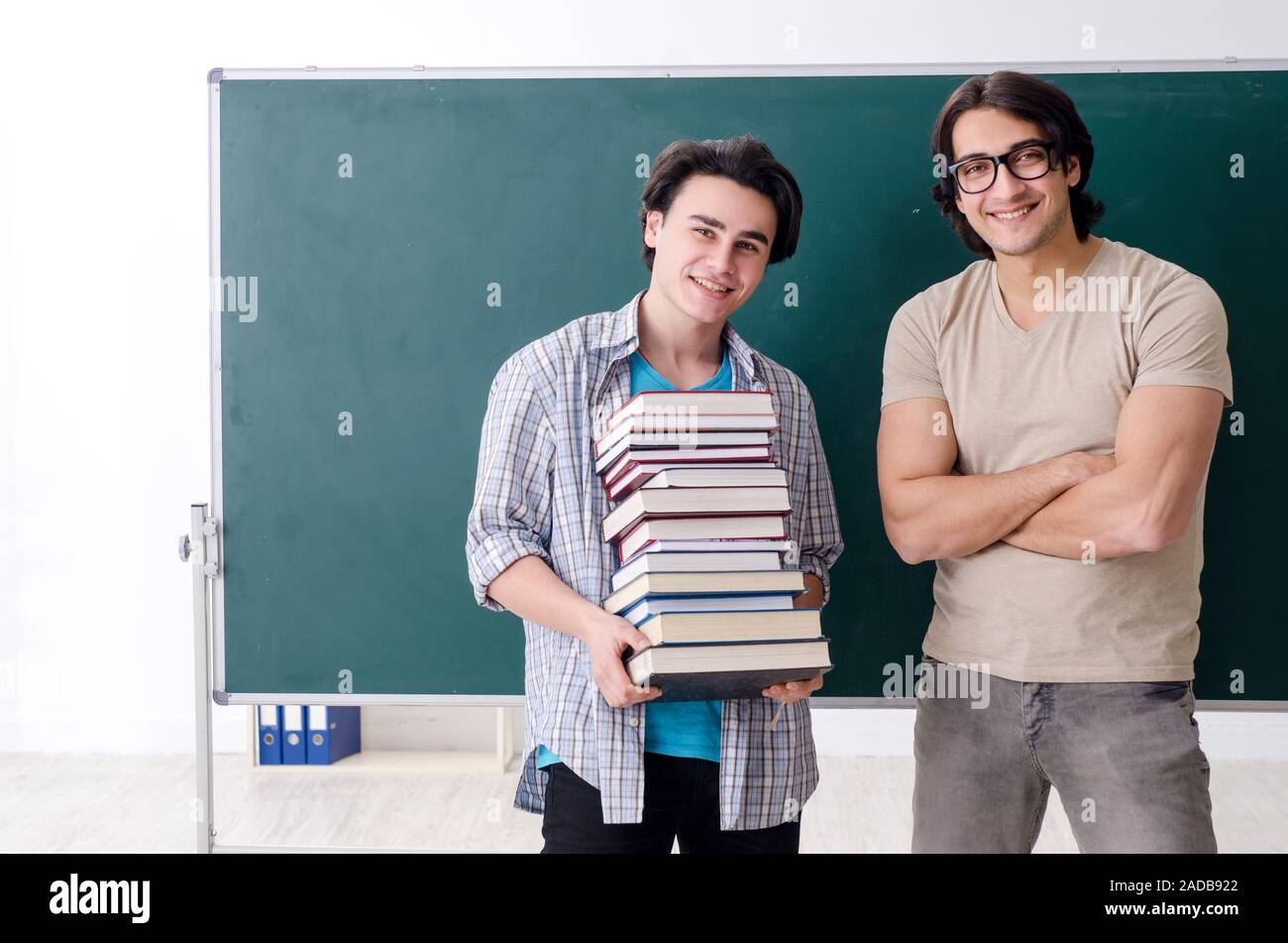 Two male students in the classroom Stock Photo - Alamy