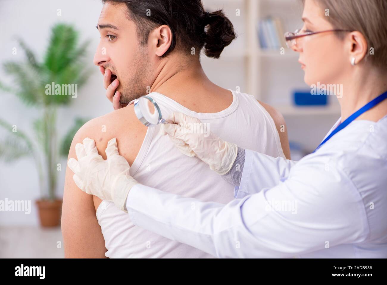Young patient visiting doctor in hospital Stock Photo - Alamy
