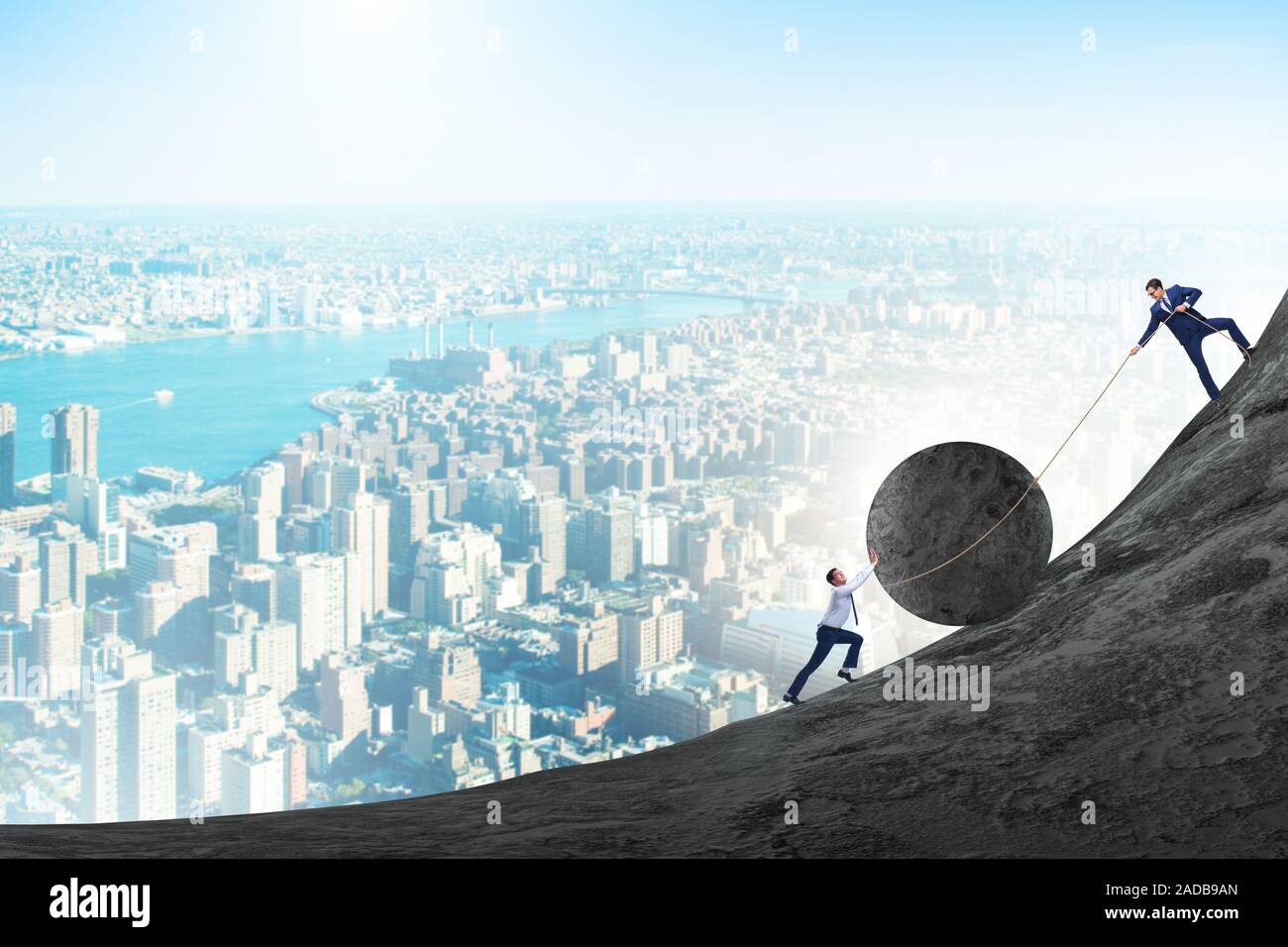 Teamwork example with Business people pushing stone to top Stock Photo ...