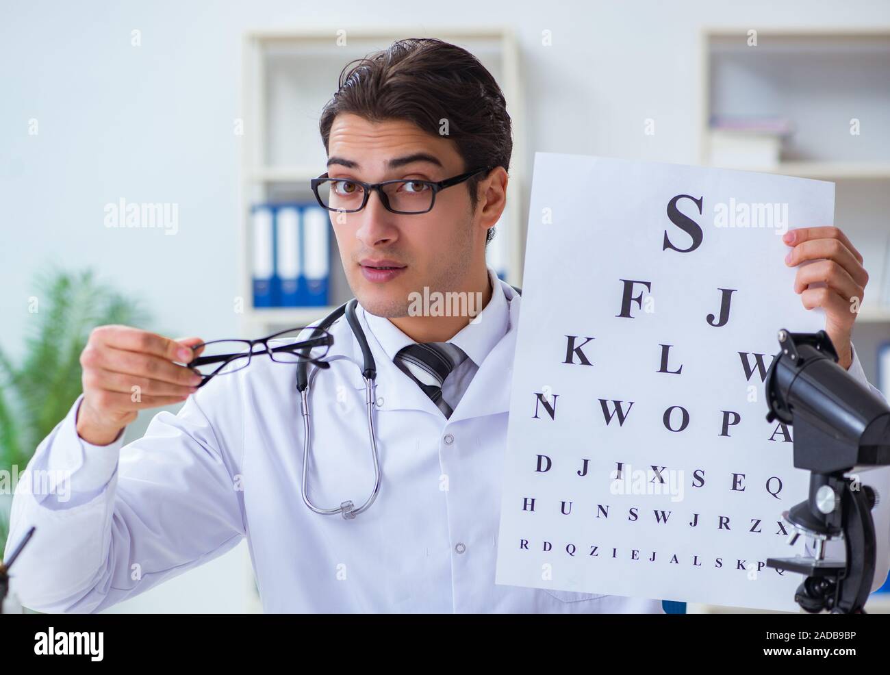 Eye doctor in medical concept Stock Photo - Alamy