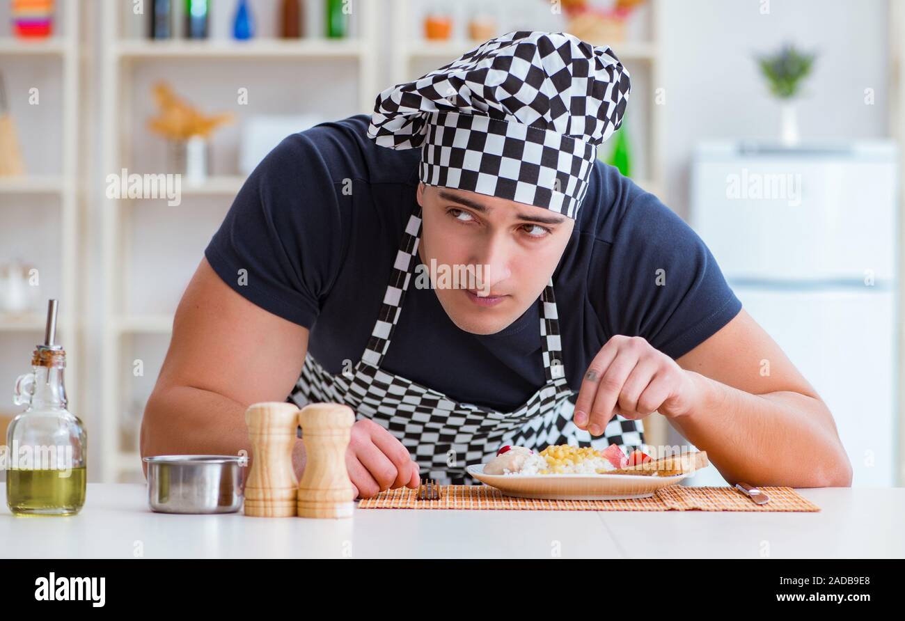 Chef cook cooking a meal breakfast dinner in the kitchen Stock Photo ...