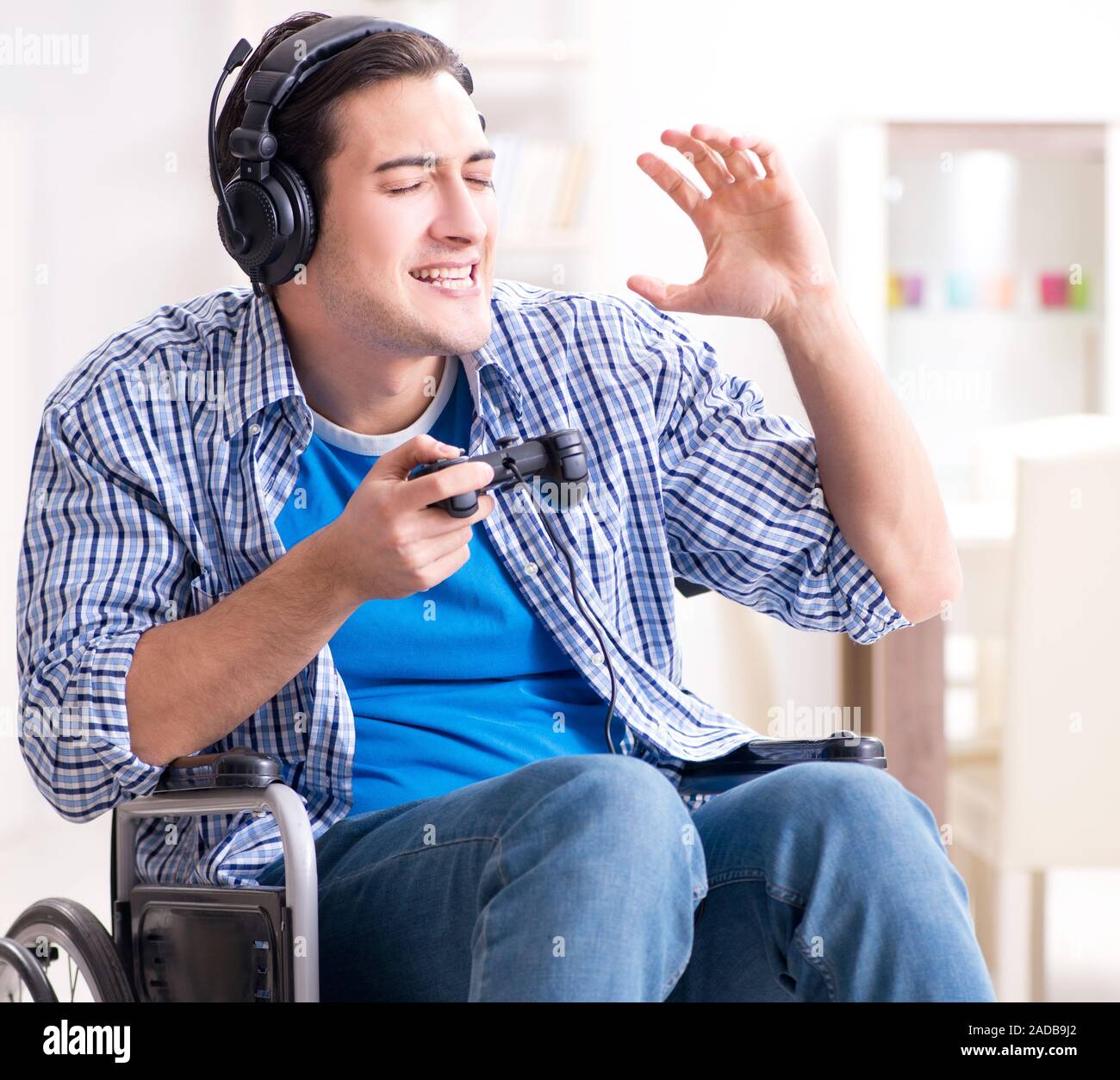 Disabled man playing computer games during rehabilitation Stock Photo ...