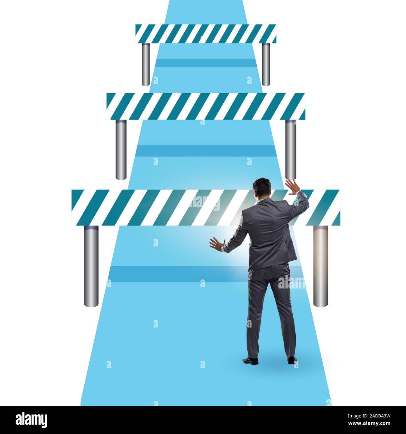 Businessman facing running barriers in challenging business Stock Photo ...