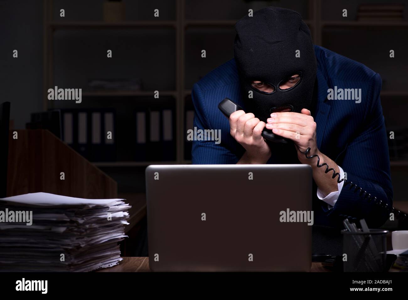 Male employee stealing information in the office night time Stock Photo ...