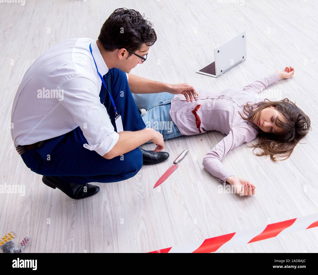 Forensic Investigator At The Crime Scene Investigating Woman Mur Stock
