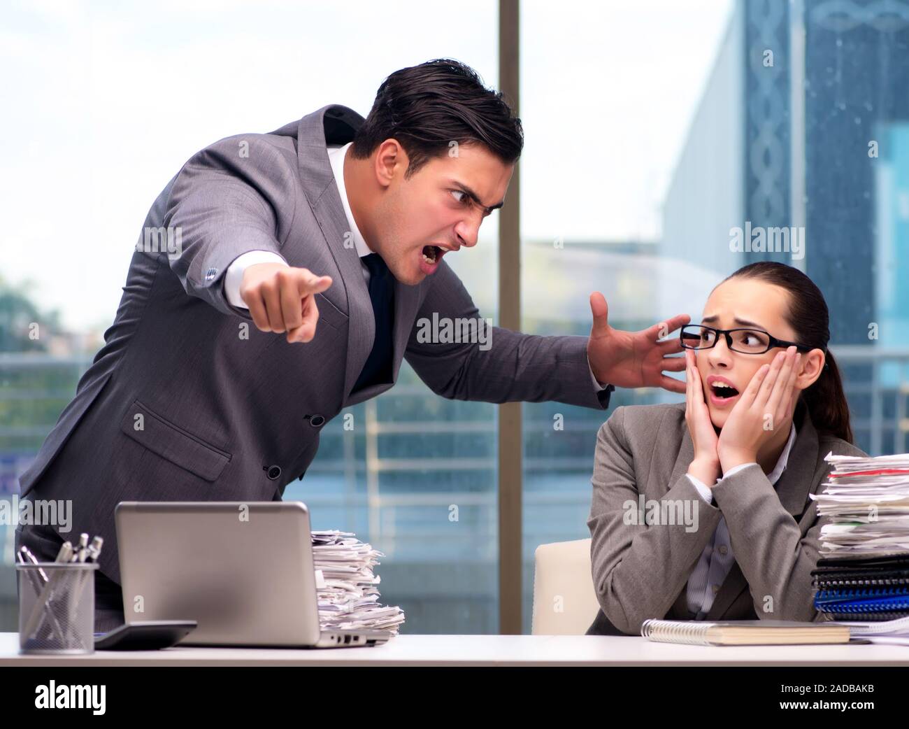 Boss yelling at his team member Stock Photo - Alamy