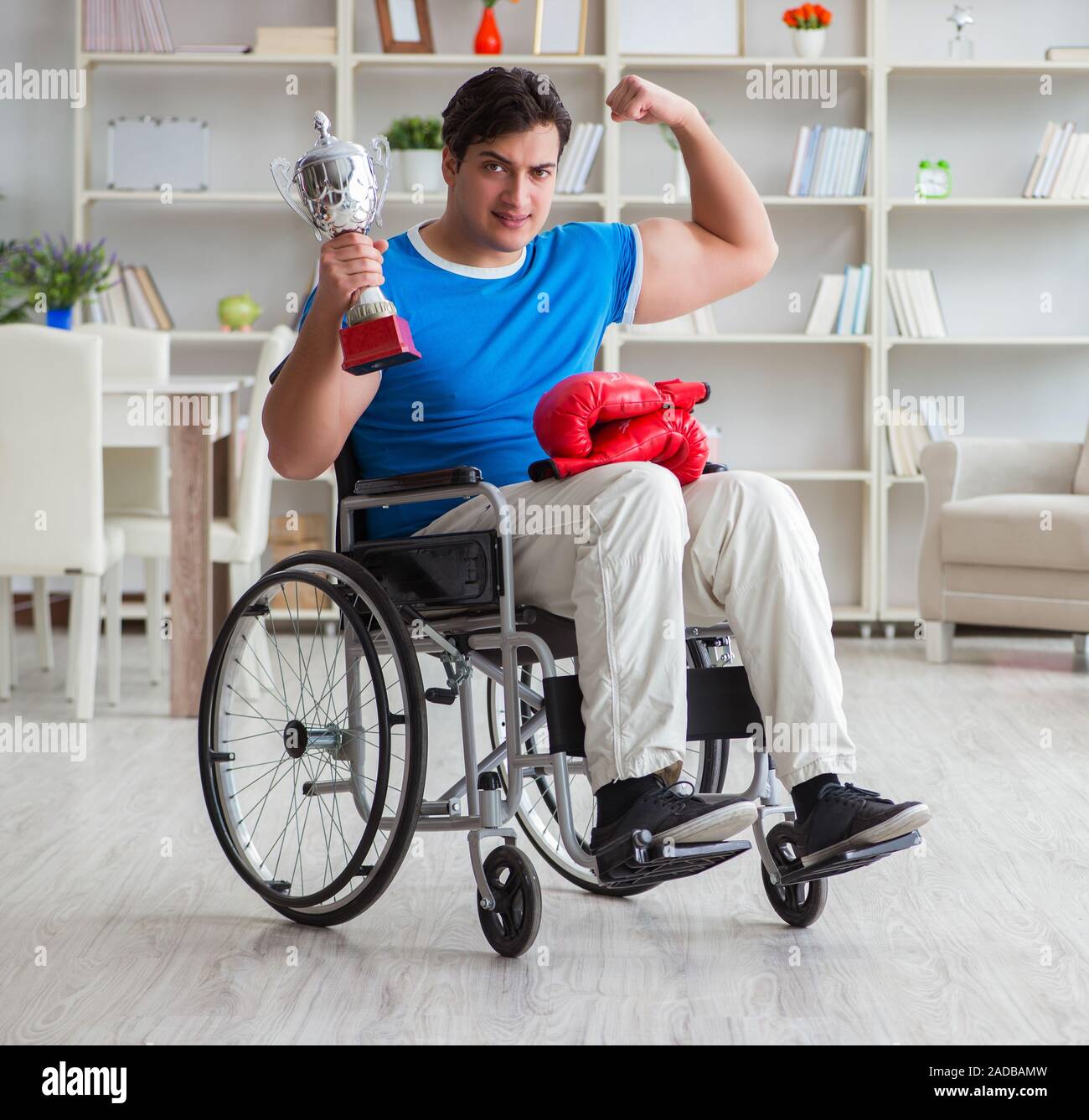 Disabled boxer at wheelchair recovering from injury Stock Photo - Alamy
